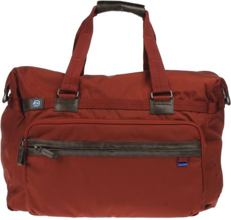 Piquadro Luggage in Red | Lyst