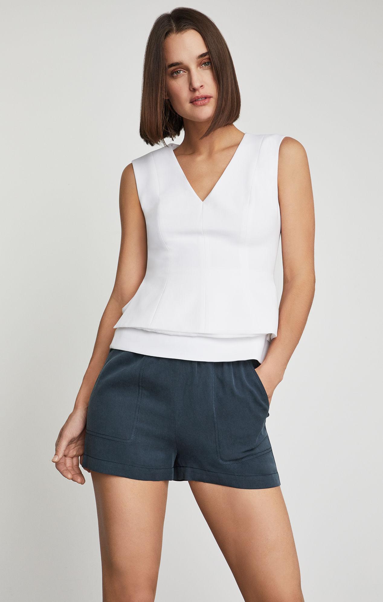 BCBGMAXAZRIA Bcbg Sleeveless Tiered Peplum Top in White - Lyst